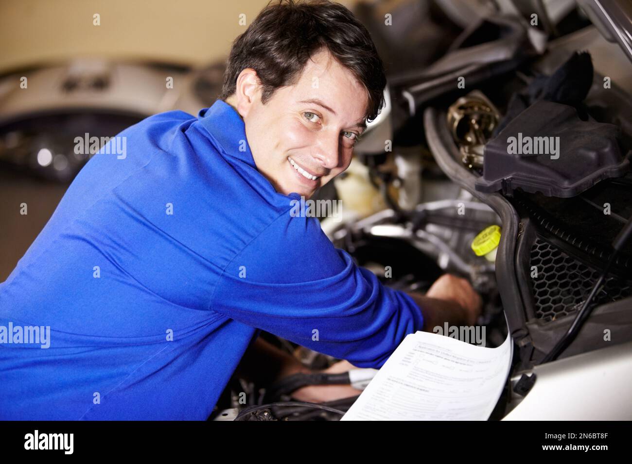 The best mechanic around. Portrait of a male mechanic working on the ...