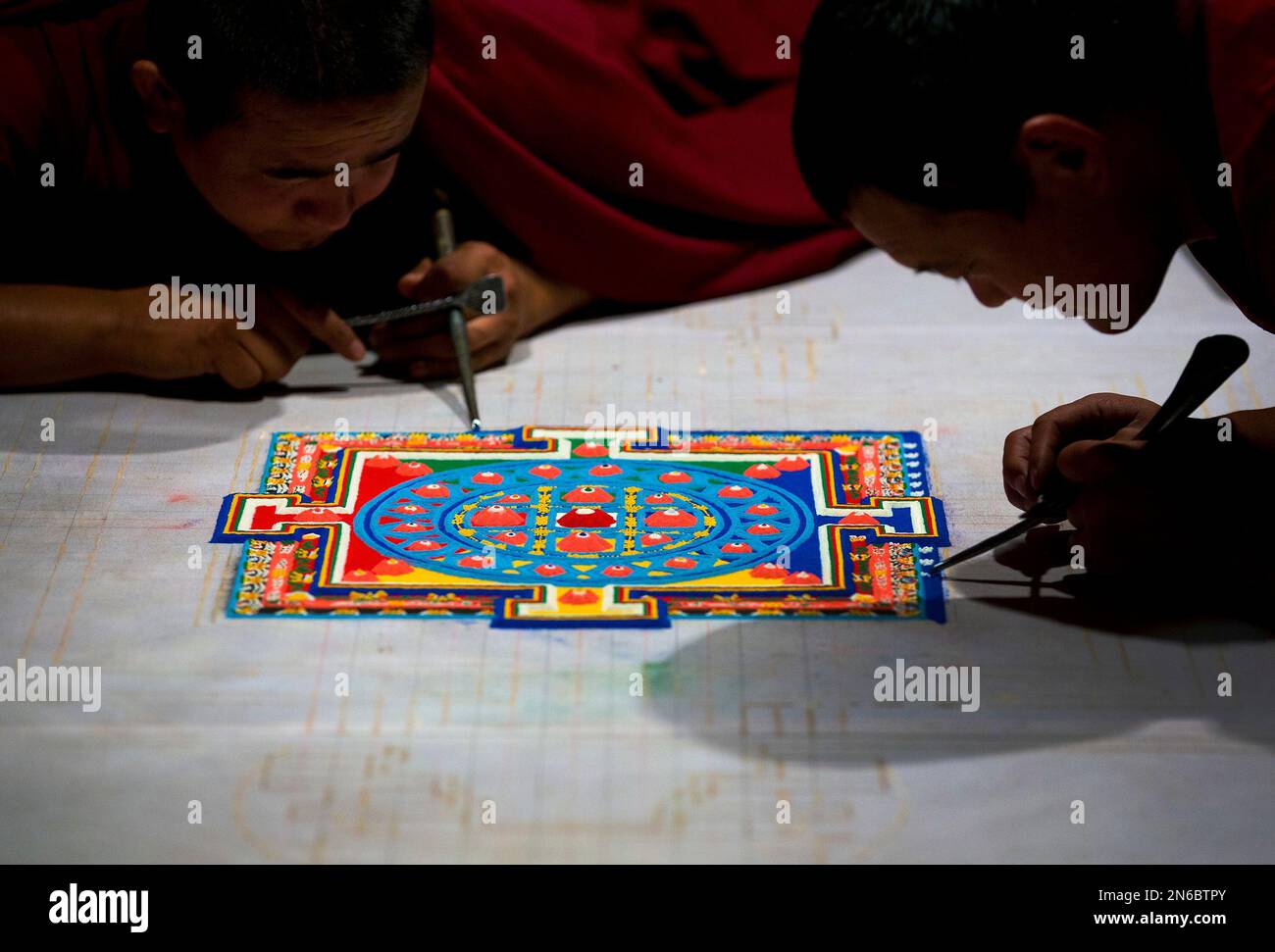 In this Oct. 16, 2013 photo, Tibetan monks use metal tools, also known ...