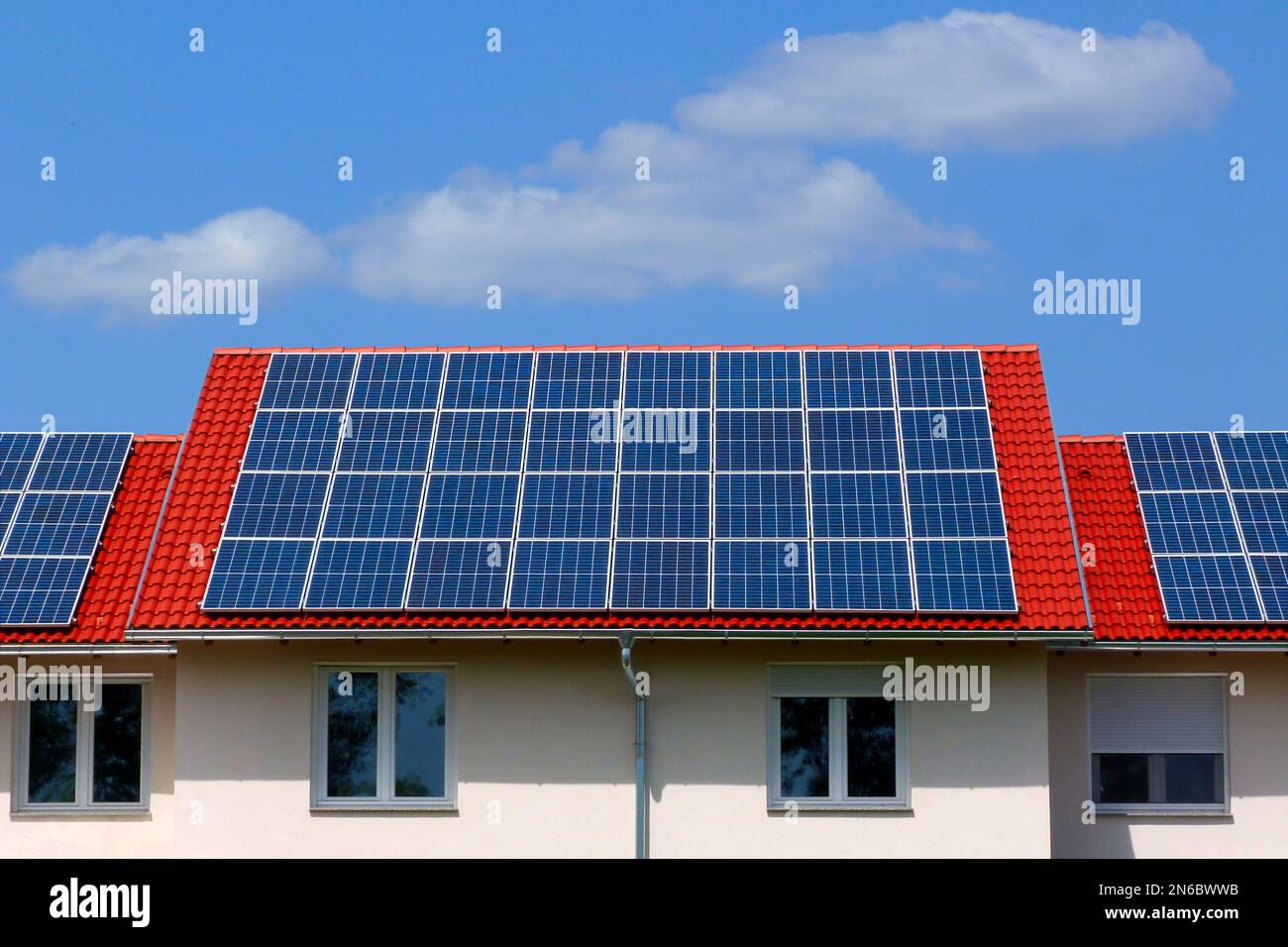 photovoltaic PV sun collector solar panels on sloped clay house roof ...