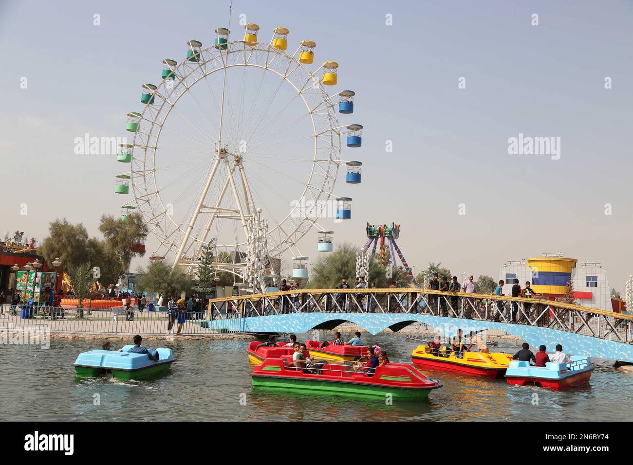 Iraqis enjoy the Eid al-Adha holiday in a park in Baghdad, Iraq ...