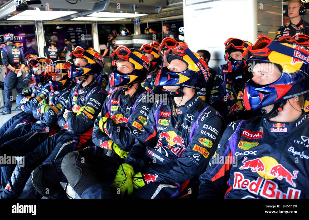 Red Bull team crew monitor the Japanese Formula One Grand Prix at their ...