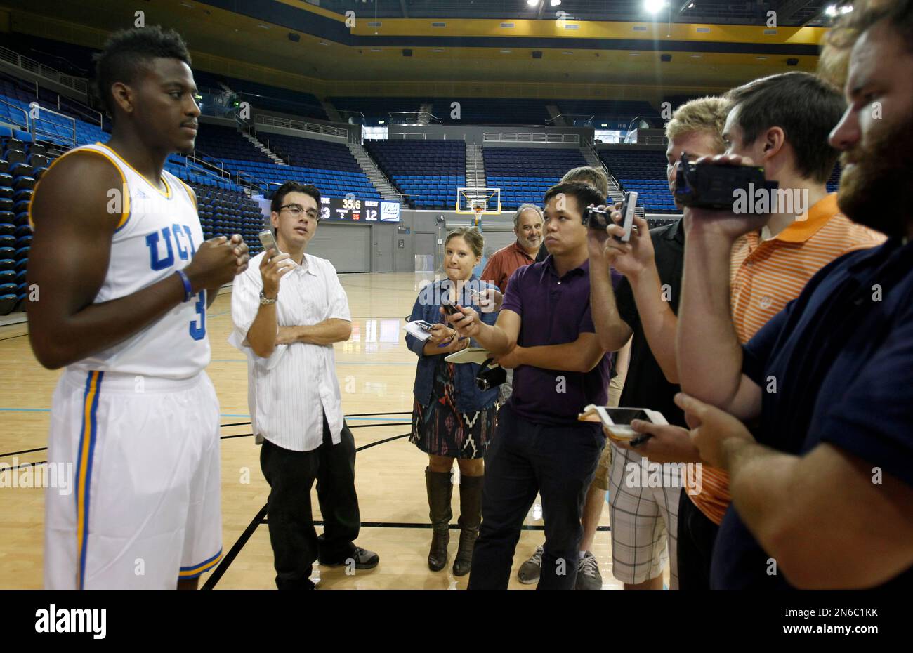 UCLA guard Jordan Adams, center, answers questions during the NCAA ...