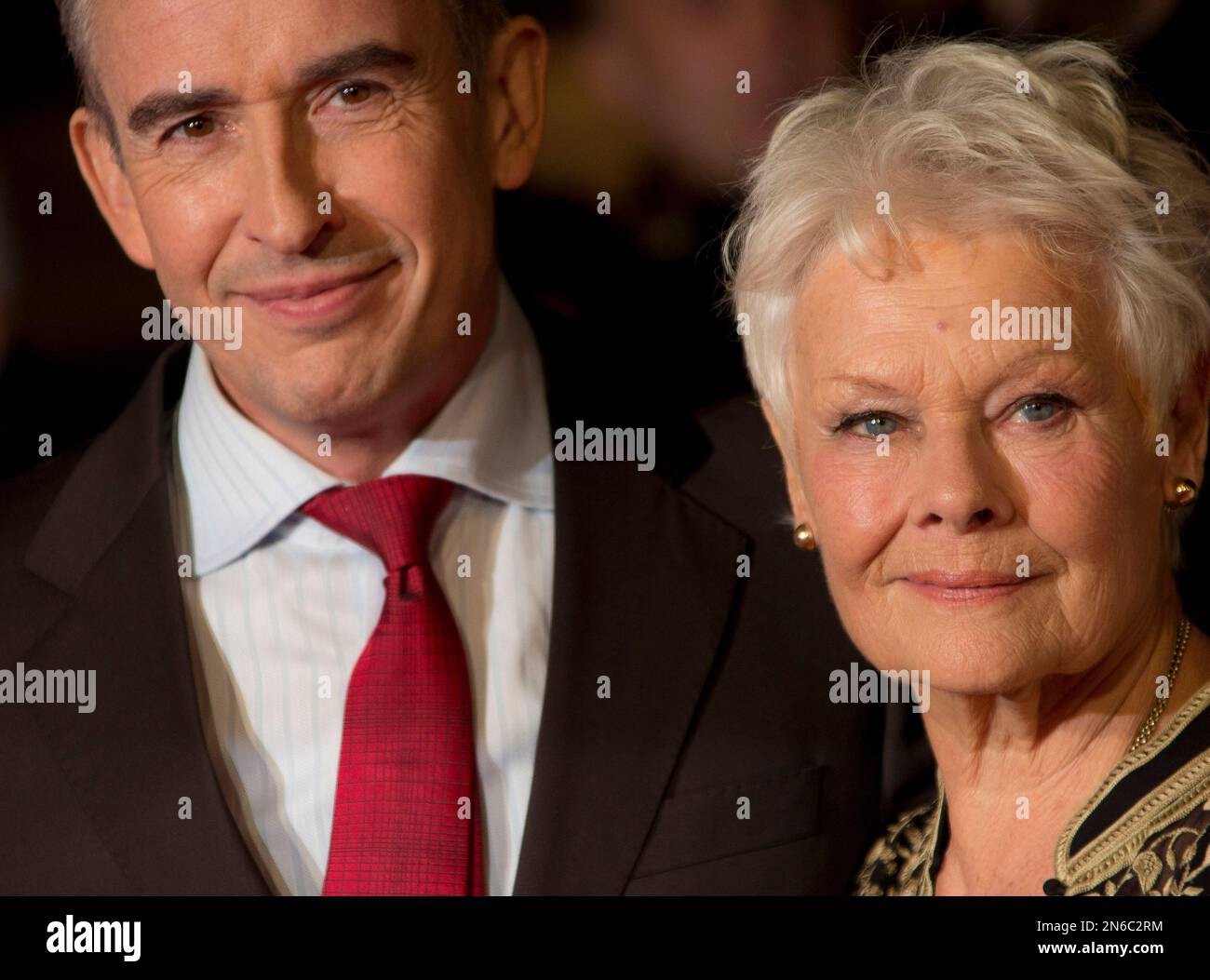 British actors Steve Coogan and Dame Judi Dench pose together during ...