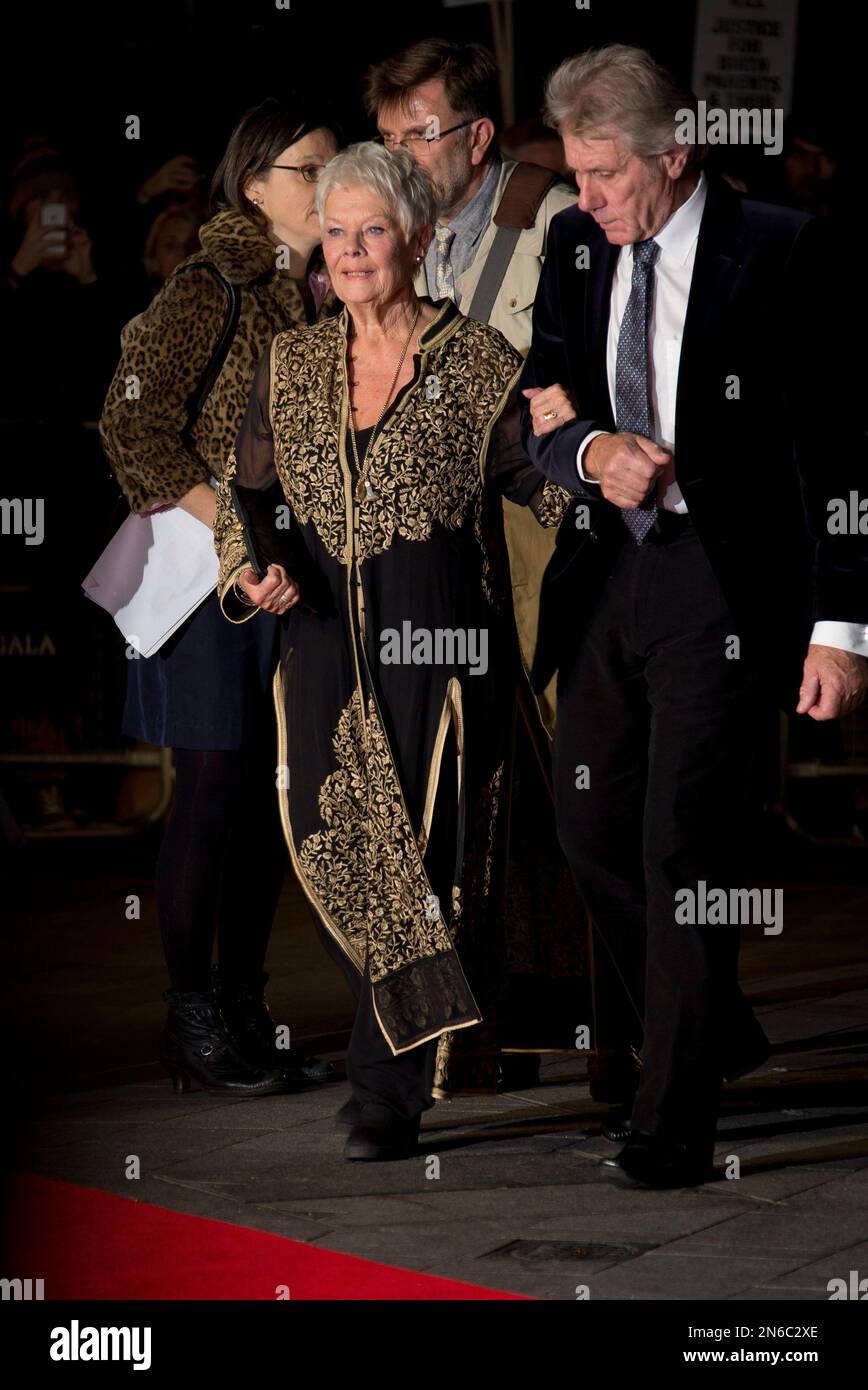 British actress Dame Judi Dench arrives with David Mills on the red ...