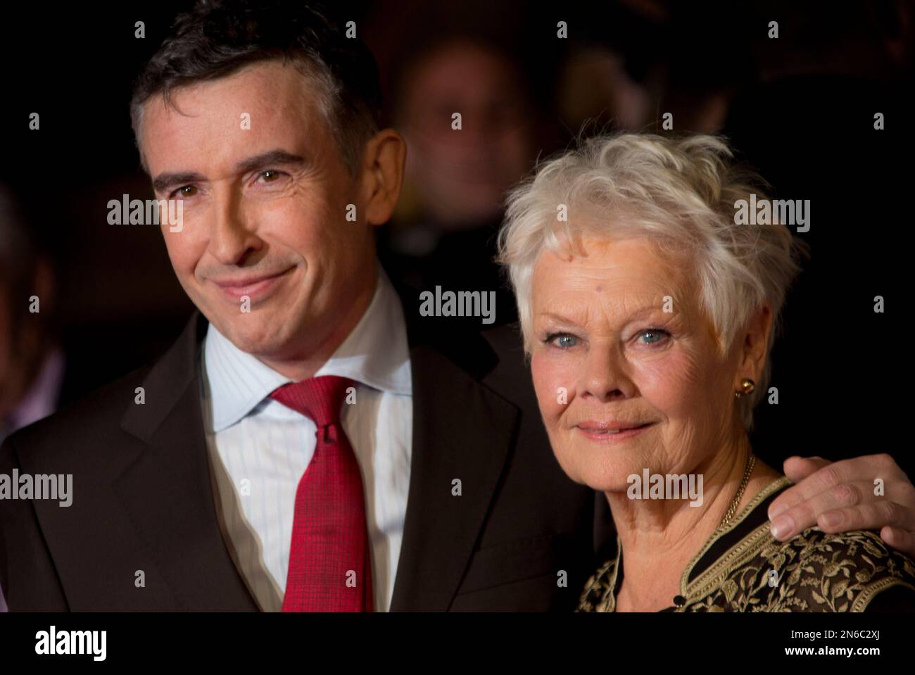 British actors Steve Coogan and Dame Judi Dench pose together during ...