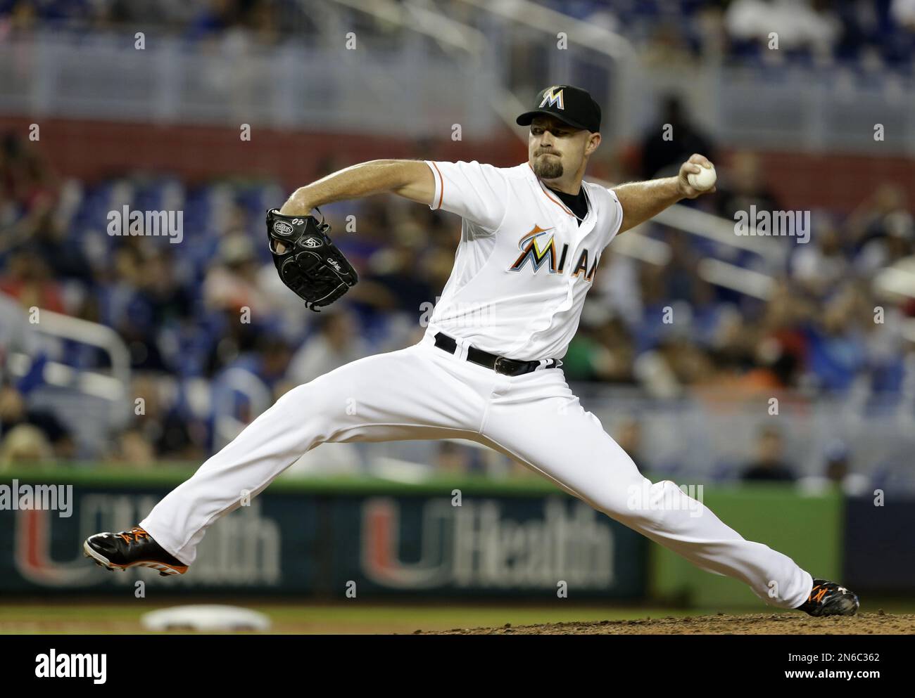 Miami Marlins relief pitcher Mike Dunn throws during a baseball game against the Los Angeles ...