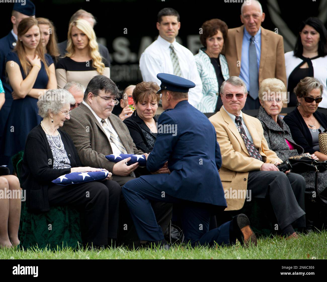 David Pietsch, second from left, is presented with an American flag by ...