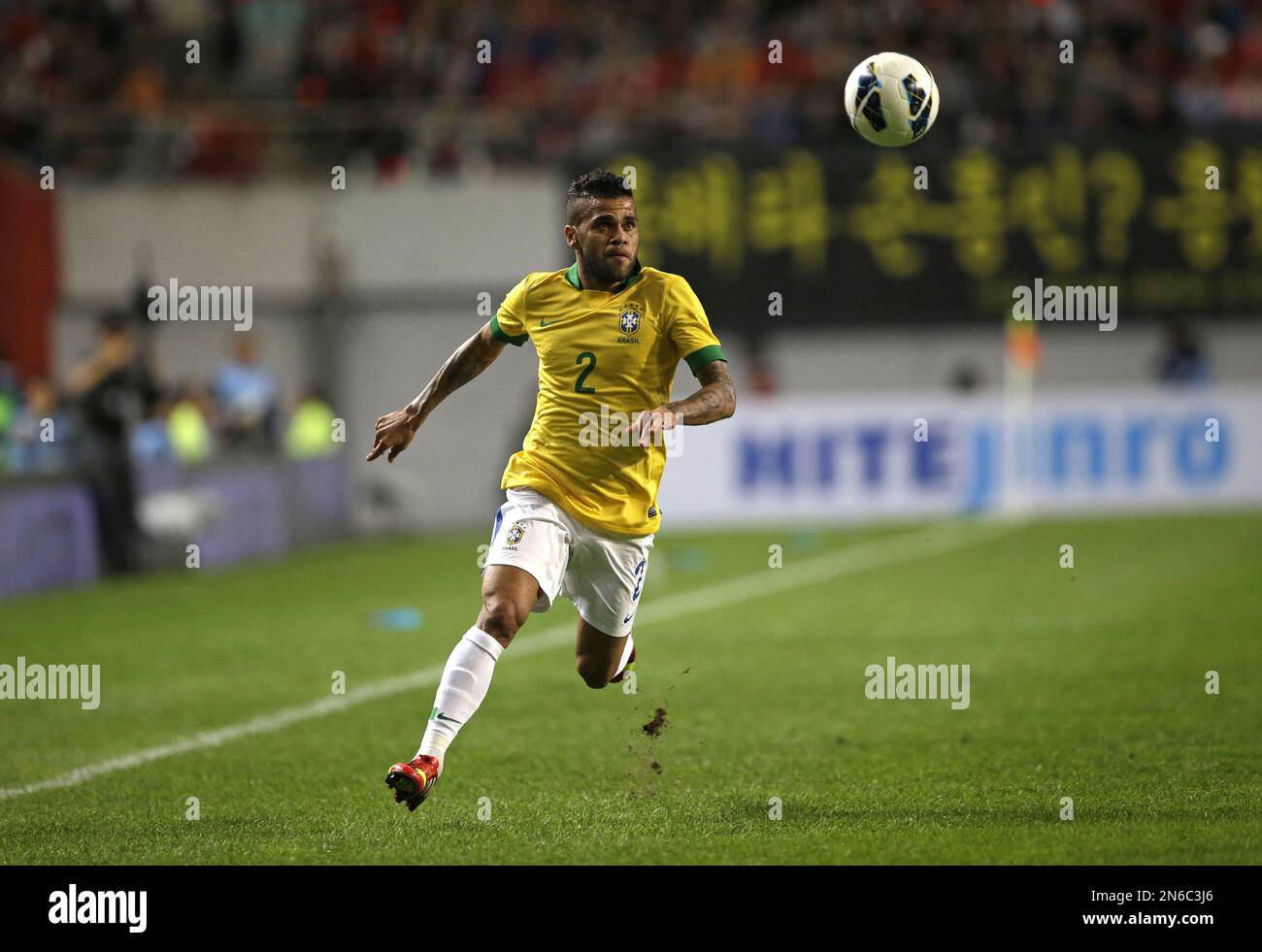 Brazil's Daniel Alves looks on a ball during a friendly soccer match against South Korea at ...