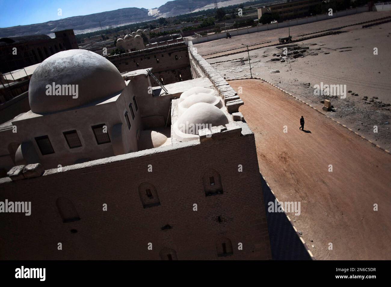 In this Sept. 30, 2013 photo, an Egyptian walks past the Anba Bishay ...