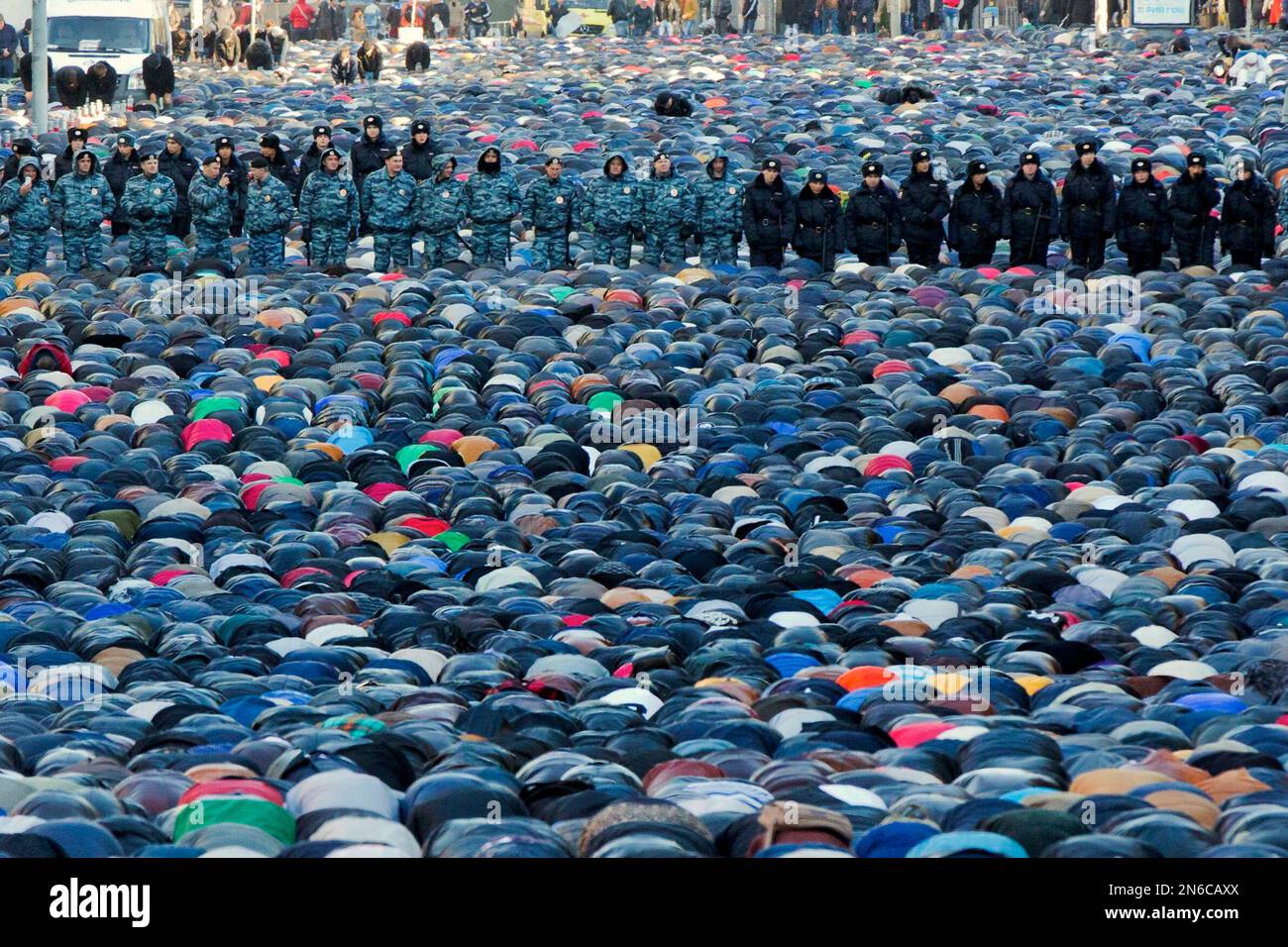Russian police officers stand guard as Muslims pray outside the main ...
