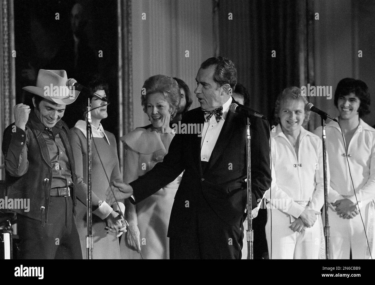 Country music singer Merle Haggard, left, is greeted by President ...