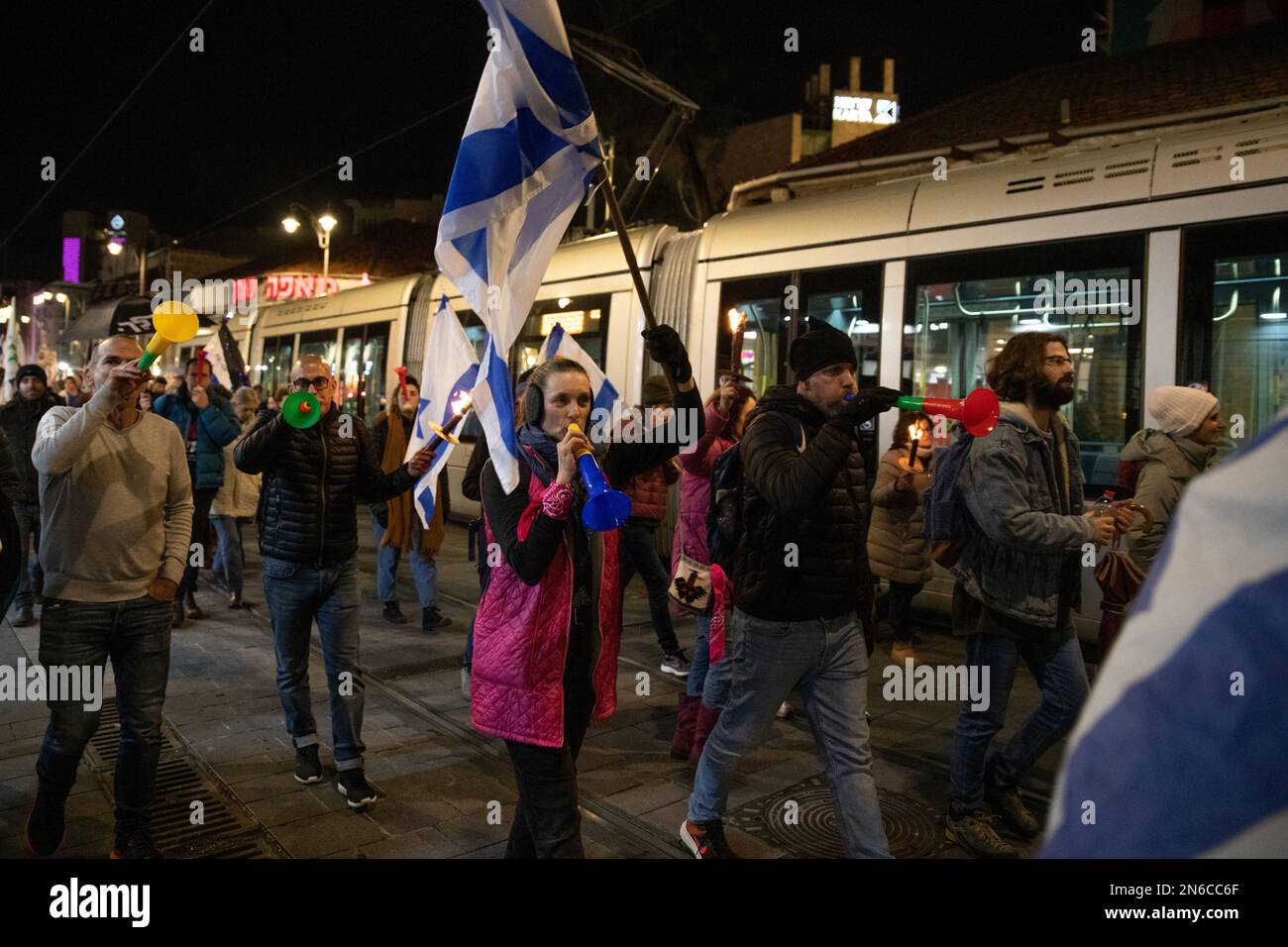 Israel: Feb 9th 2023.Protestors march on the light rail path. Houndreds ...