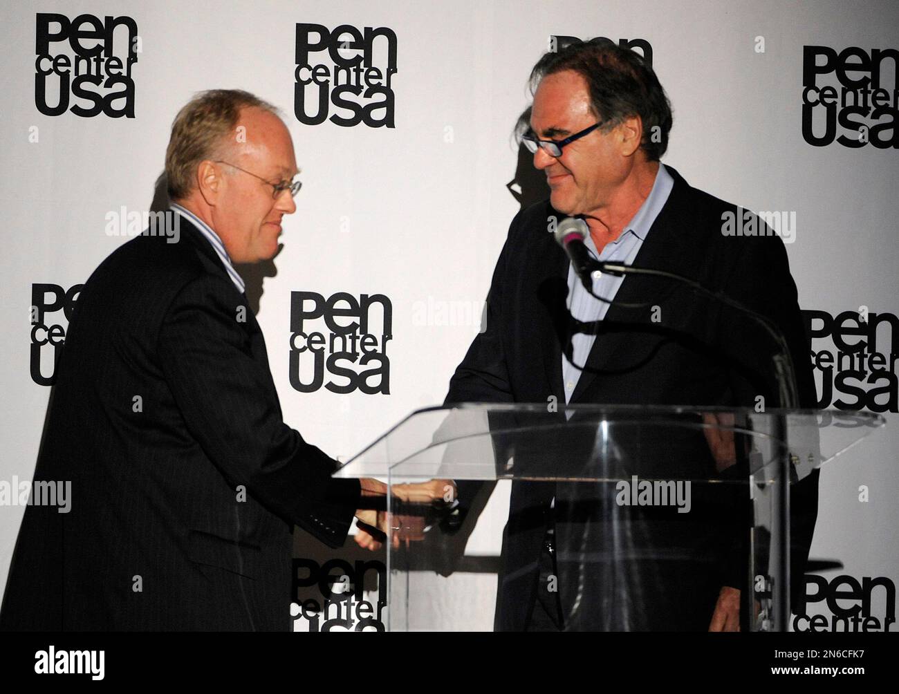 Director Oliver Stone, right, presents the First Amendment award to ...