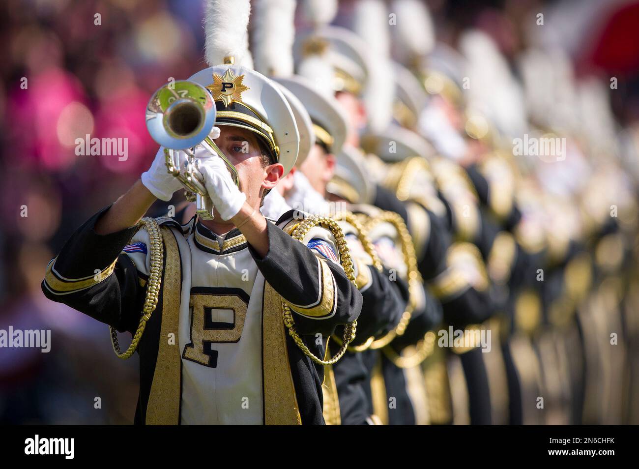 Members of the Purdue marching band perform during pre-game activities ...