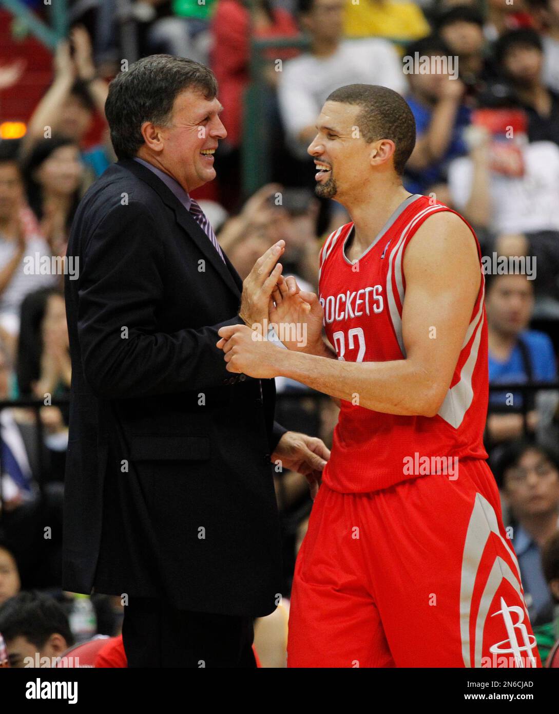 NBA Houston Rockets Francisco Garcia (32) is cheered by coach Kevin ...