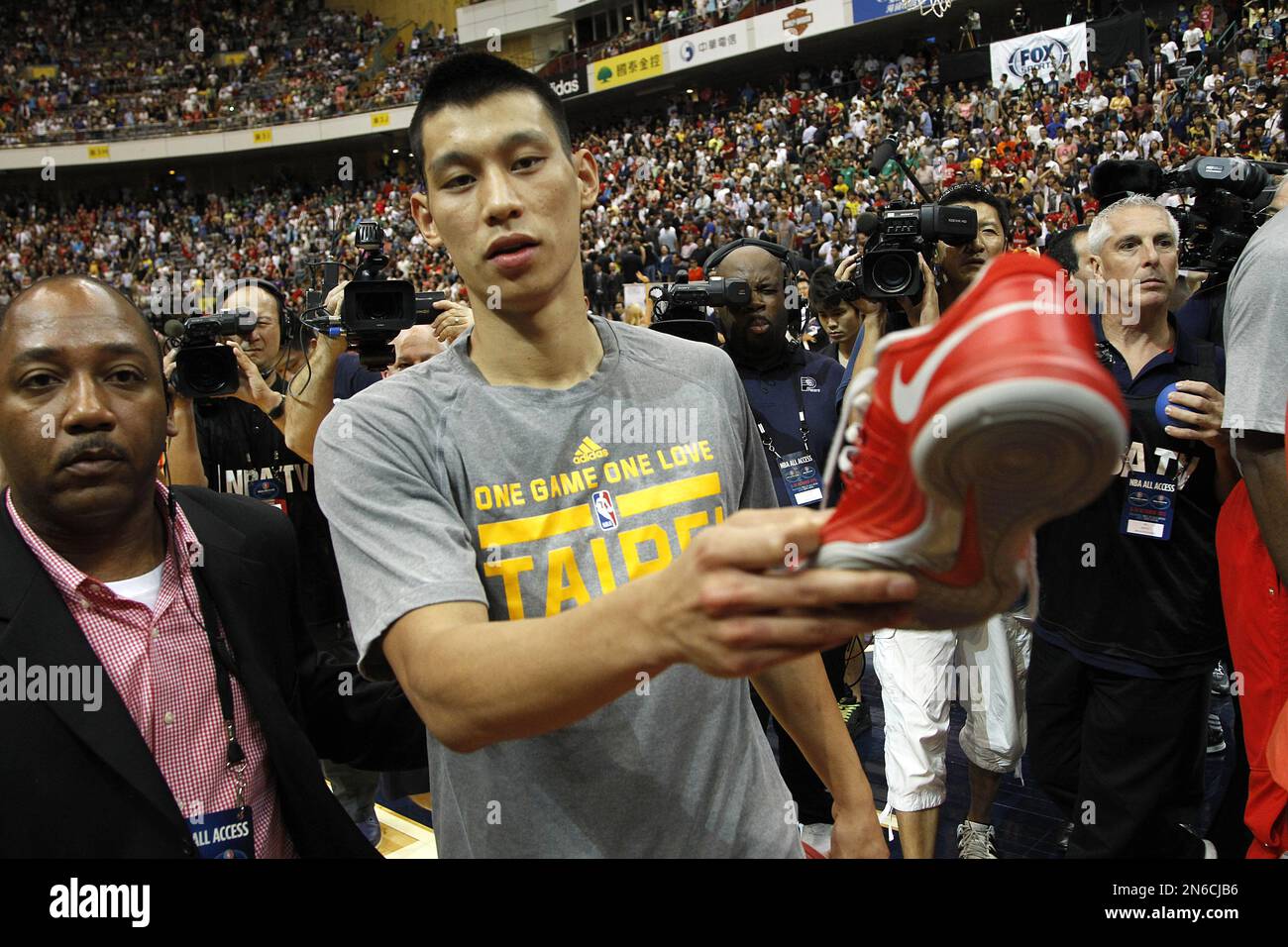 NBA Houston Rockets Jeremy Lin, #7, prepares to give away his shoes to ...