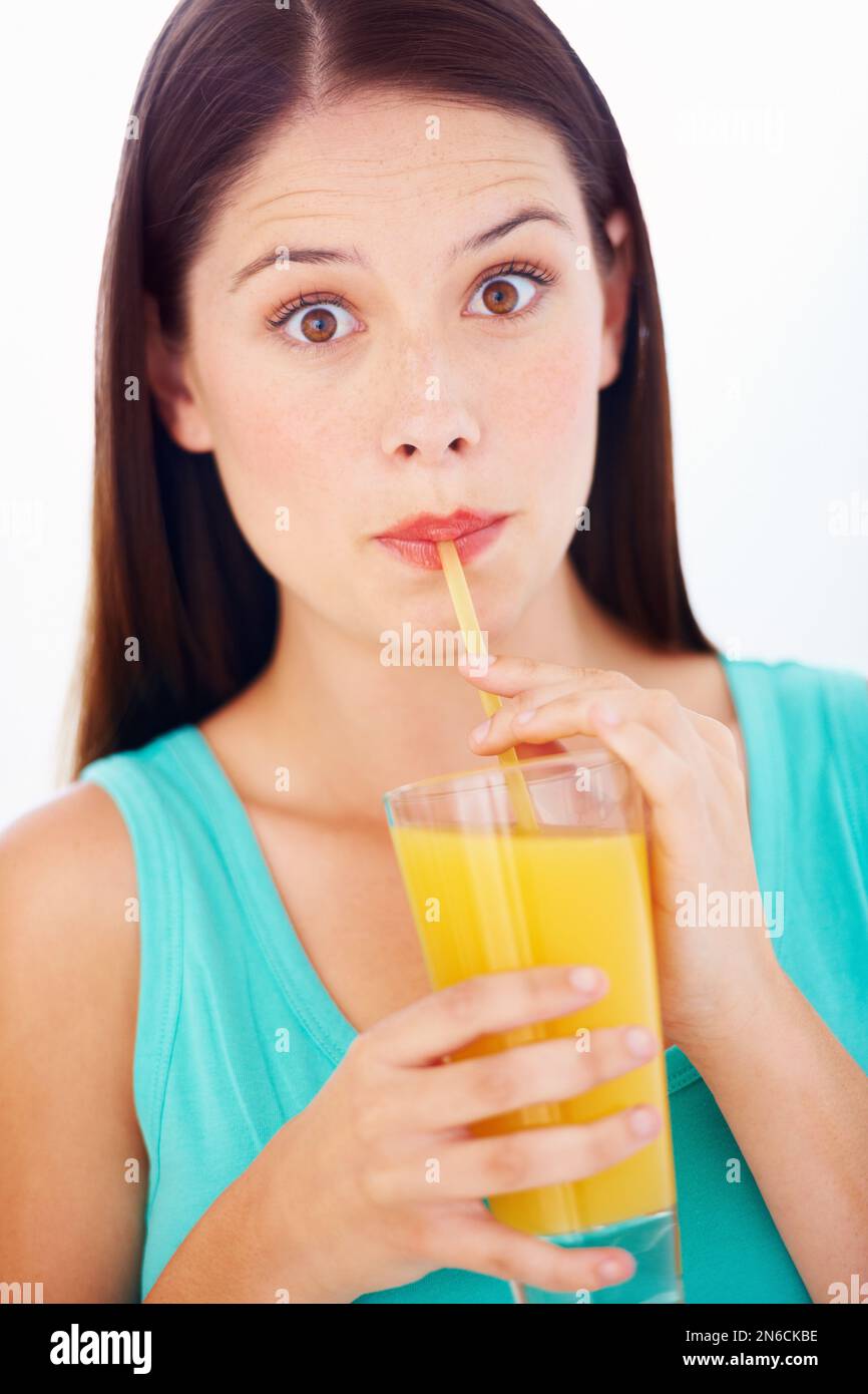 This orange juice is amazing. Portrait of a beautiful young woman ...