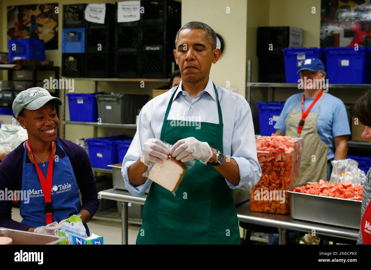 President Barack Obama stands with volunteer Chantelle Britton, who ...