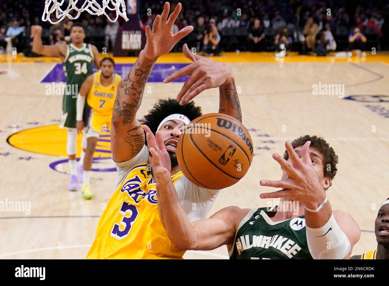 Los Angeles Lakers forward Anthony Davis, left, and Milwaukee Bucks ...