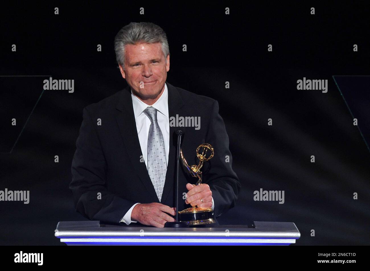 NORTH HOLLYWOOD, CA - AUGUST 06: Chuck Henry of NBC4 presents an award ...