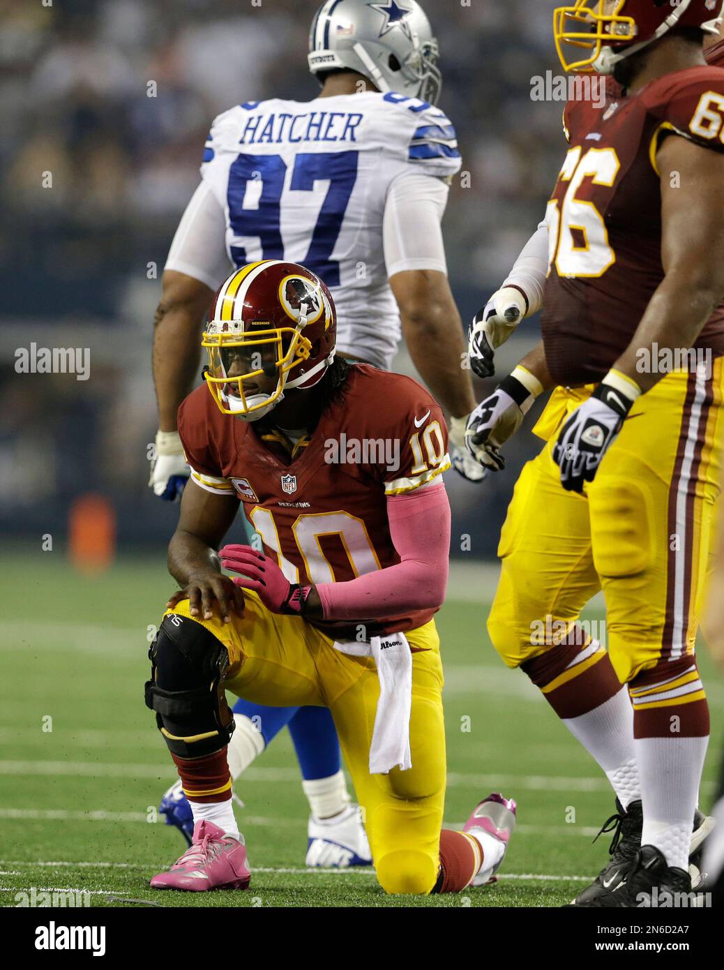 Washington Redskins quarterback Robert Griffin III (10) gets up off the ...