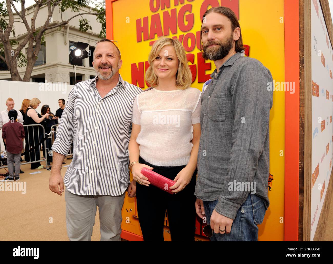 Cast member Amy Poehler, center, poses with executive producer Aron ...
