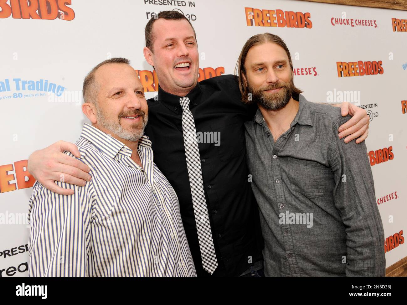 Jimmy Hayward, center, writer/director of "Free Birds," poses with ...