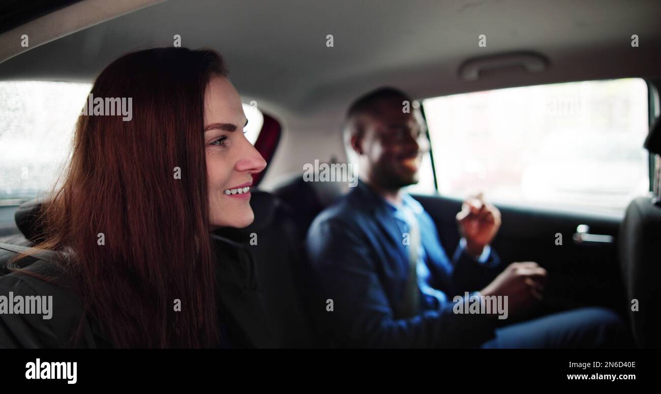 Smiling People Sitting Inside The Ride Sharing Car Stock Photo - Alamy