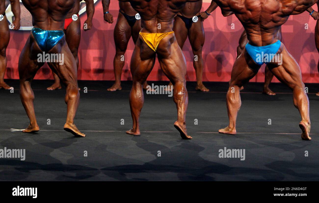 Various unidentified amateur competitors flex their muscles during the ...