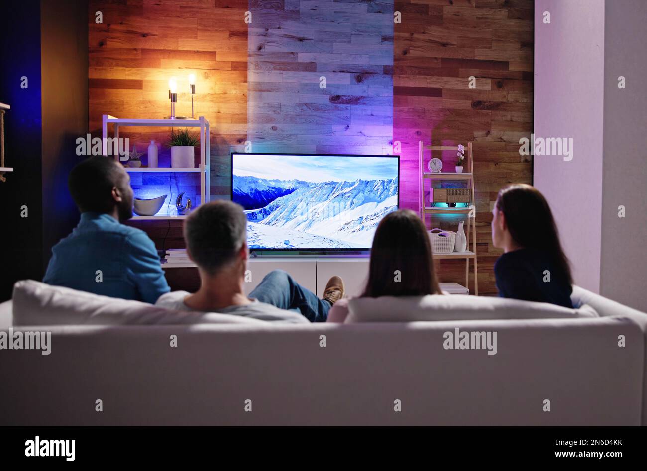 African Family Watching TV Movie On Television Stock Photo - Alamy