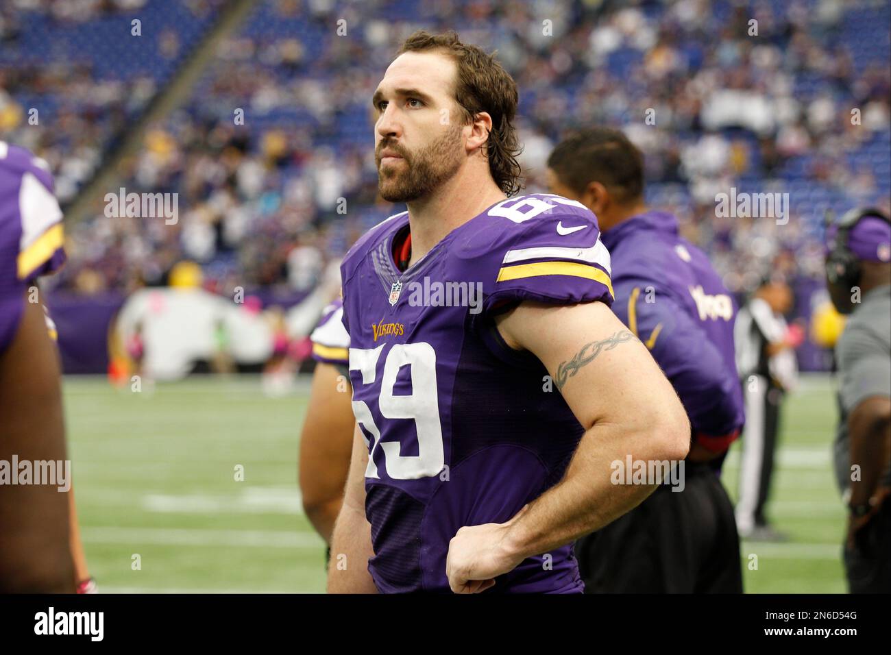 Minnesota Vikings defensive end Jared Allen looks at the scoreboard ...