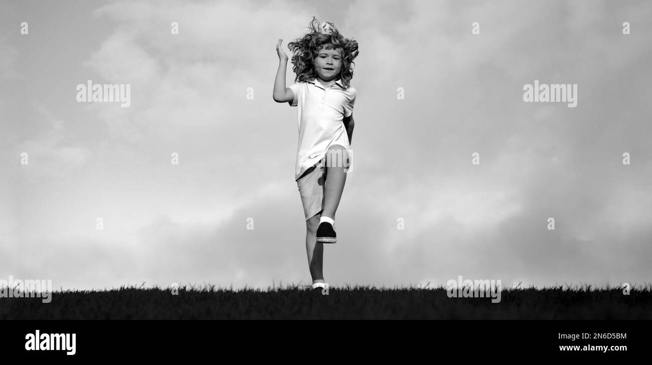 Cute little girl jumping on Black and White Stock Photos & Images - Alamy