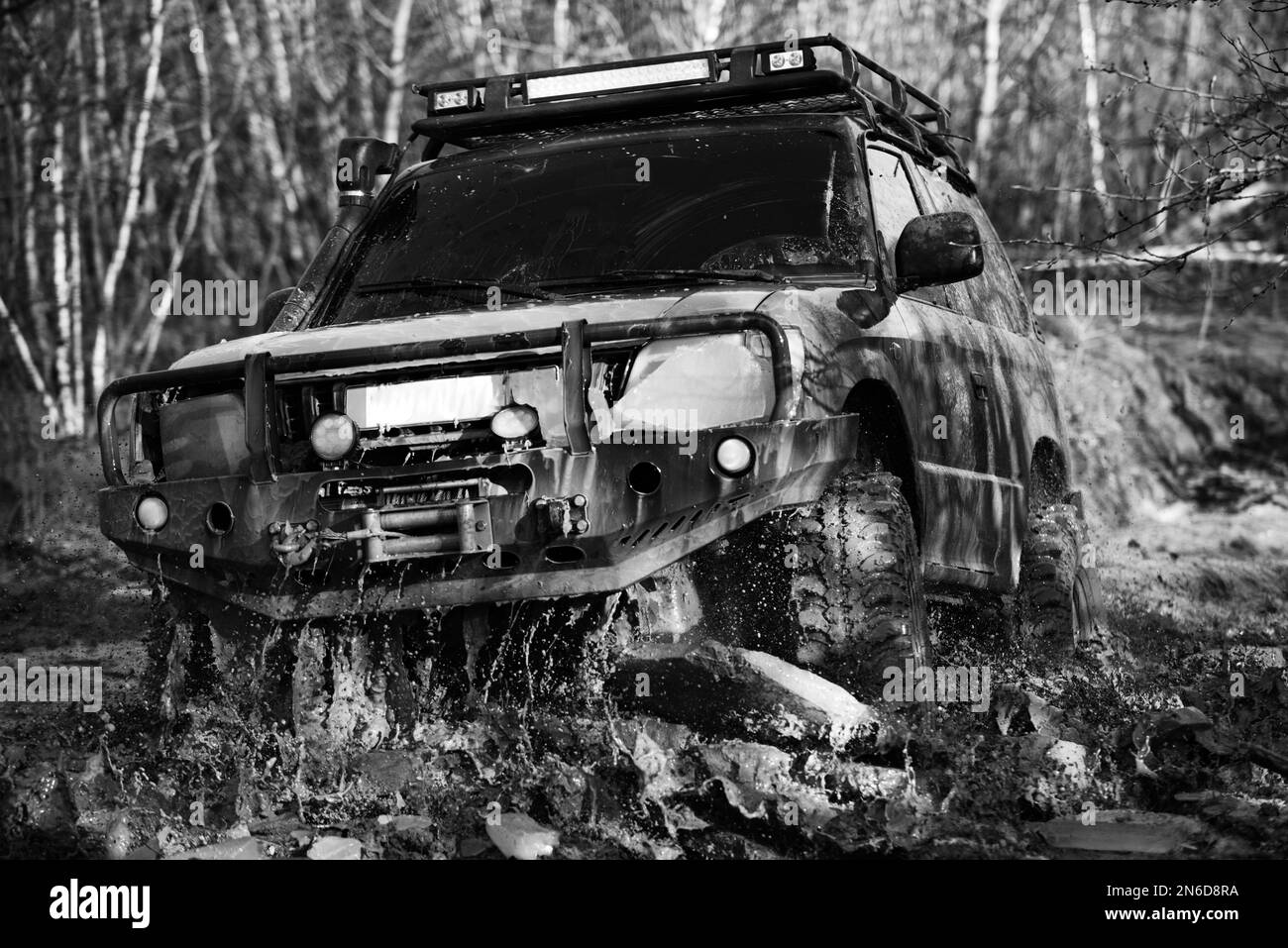 Off-road sport truck between mountains landscape. Track on mud. Off ...
