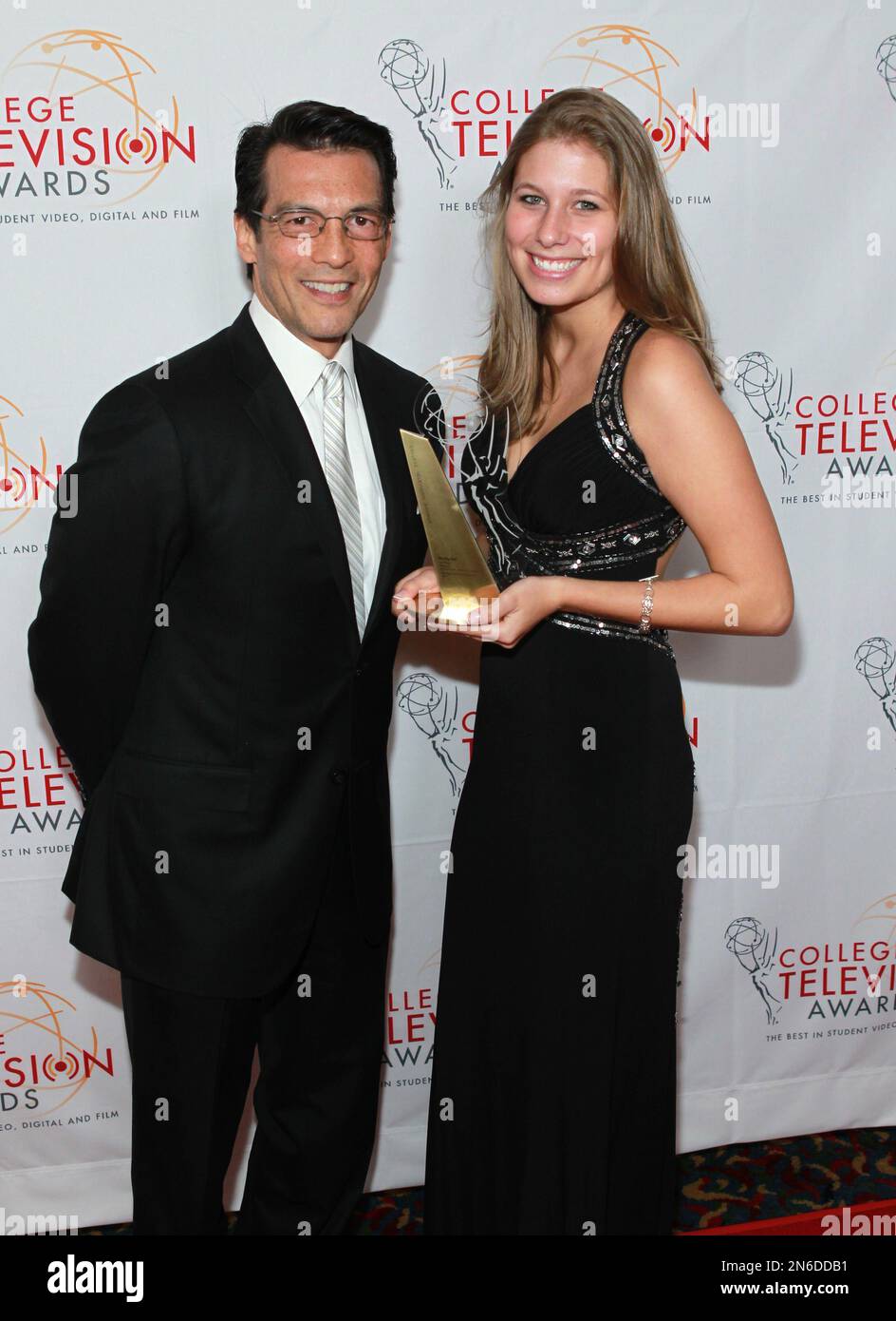 HOLLYWOOD, CA - MARCH 31: David Ono, Shelby Hill pose in the press room ...