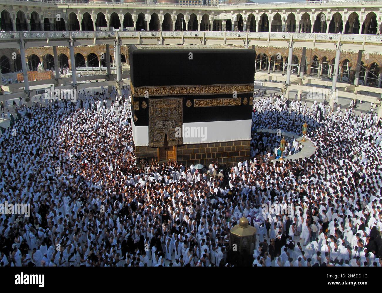 Muslim pilgrims circle counterclockwise with their hearts tilted toward ...