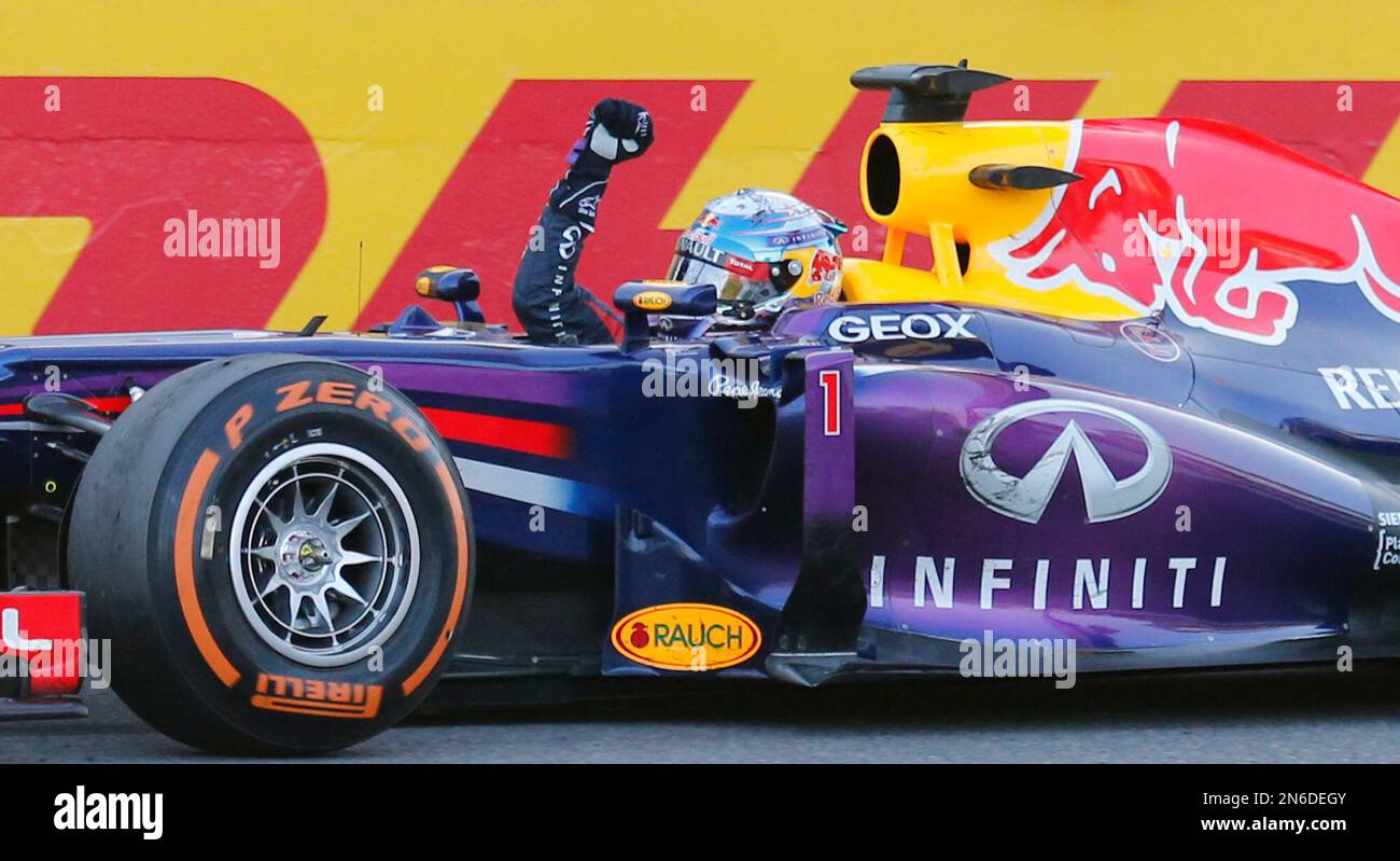 Red Bull driver Sebastian Vettel of Germany celebrates after crossing ...