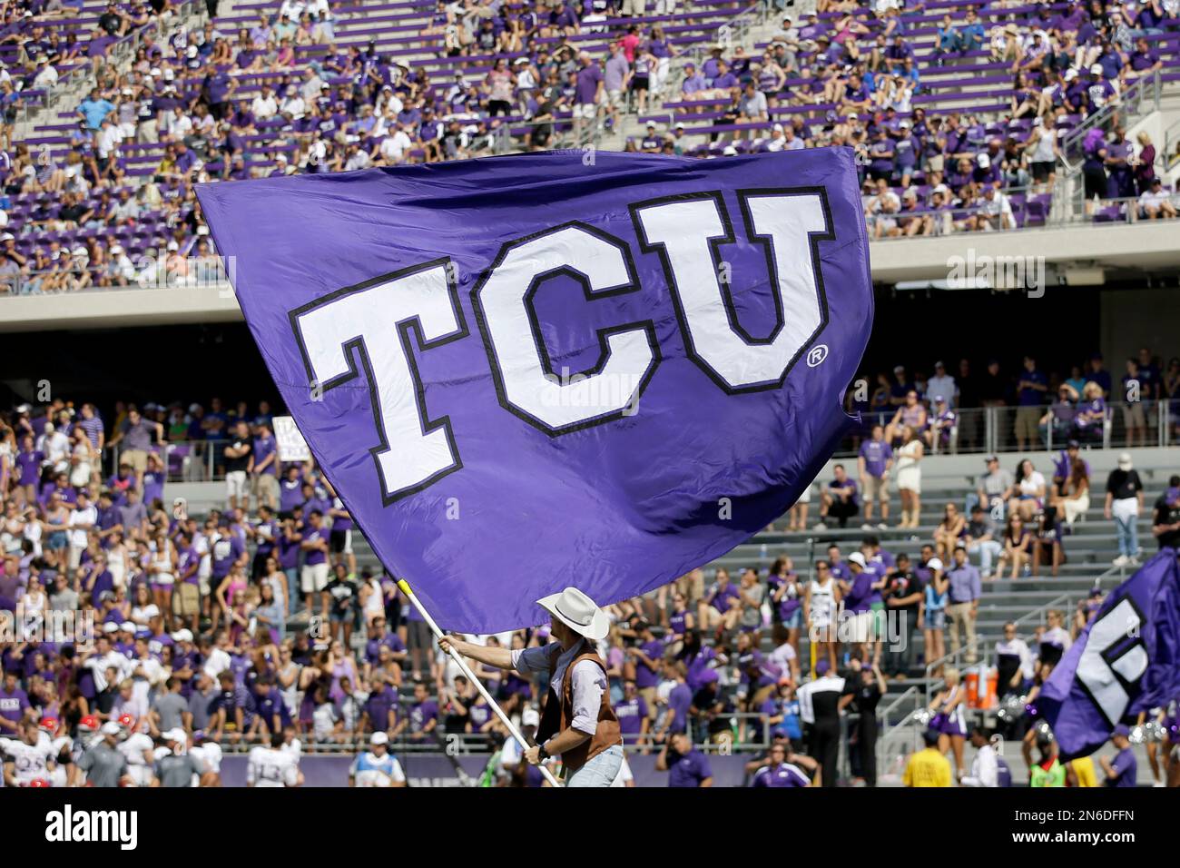 Members of the TCU cheer team celebrate scoring in the second half of ...