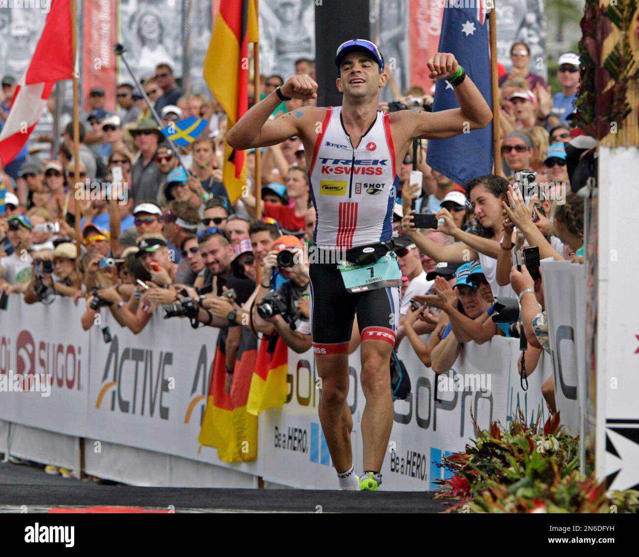 Tim O'Donnell, of the United States, crosses the finish line to place ...