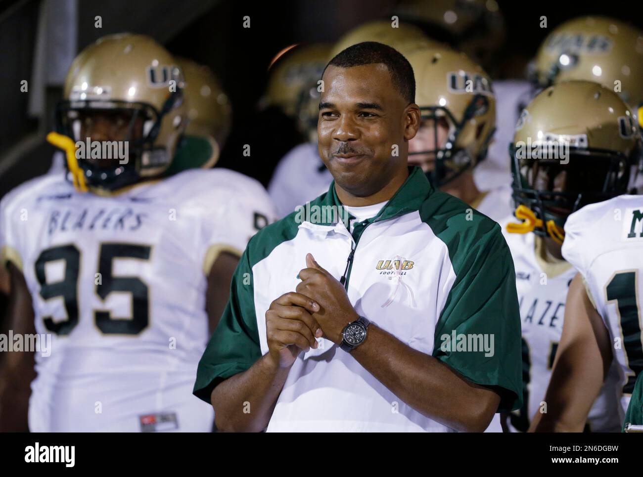 UAB head coach Garrick McGee prepares to run onto the field with the ...