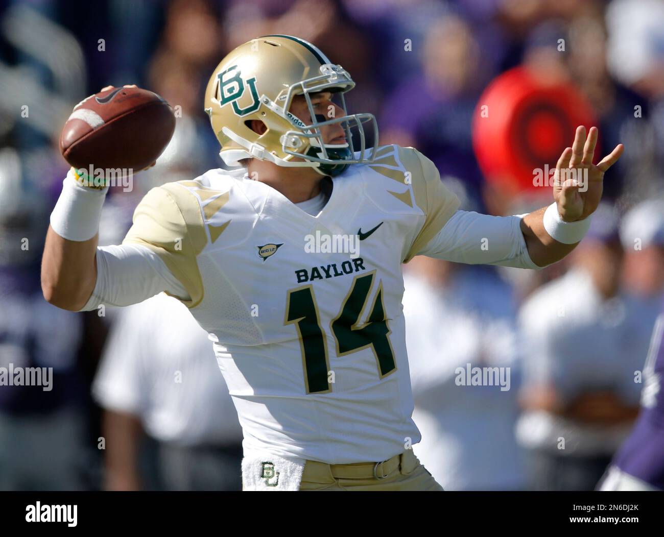 Baylor quarterback Bryce Petty (14) passes to a teammate during the ...