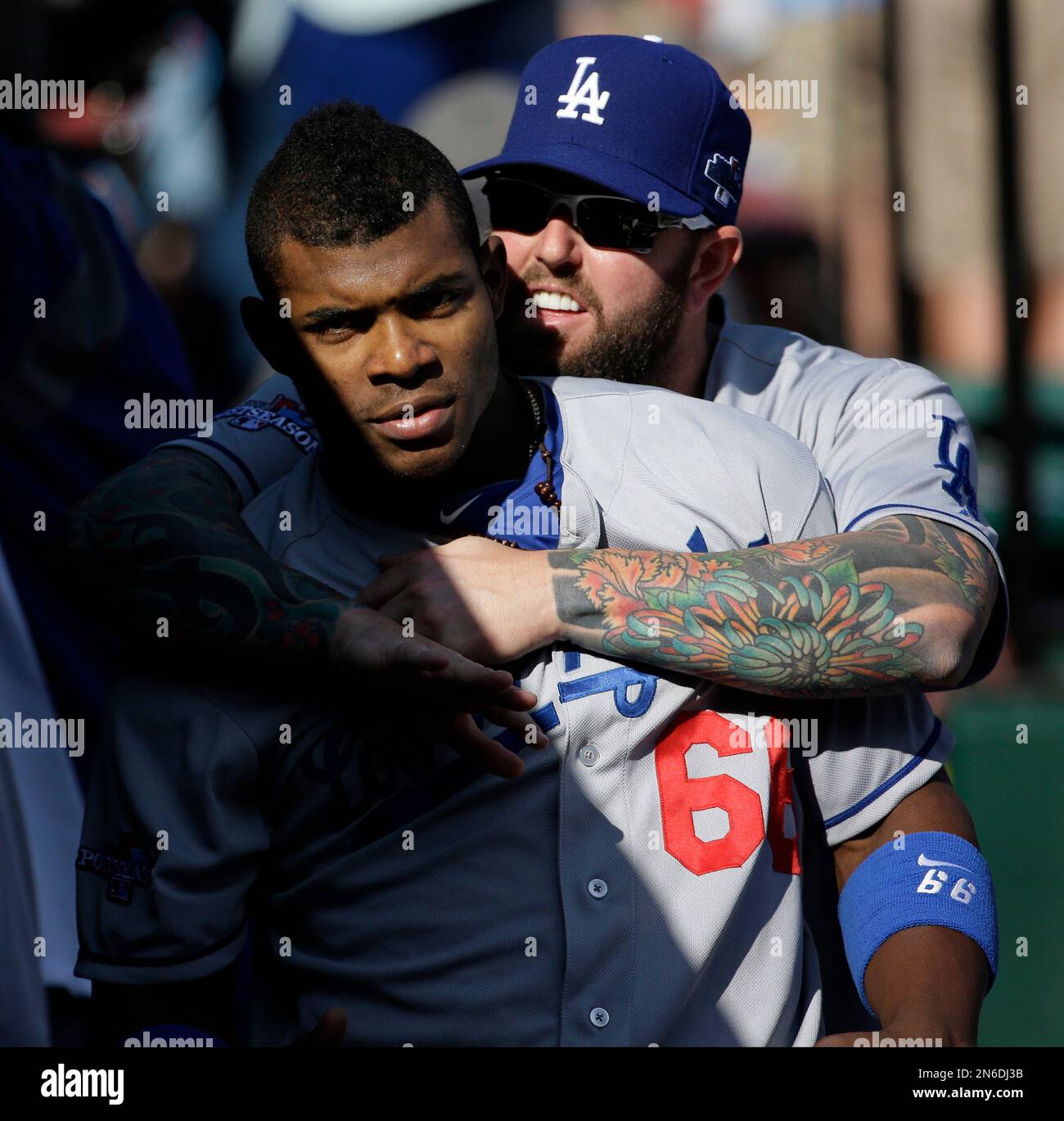 Los Angeles Dodgers' Yasiel Puig (66) and Chris Withrow joke around ...