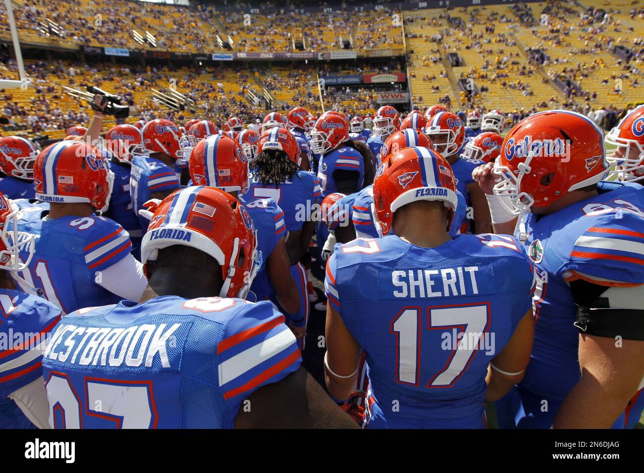 Florida players huddle during warm-ups before an NCAA college football ...