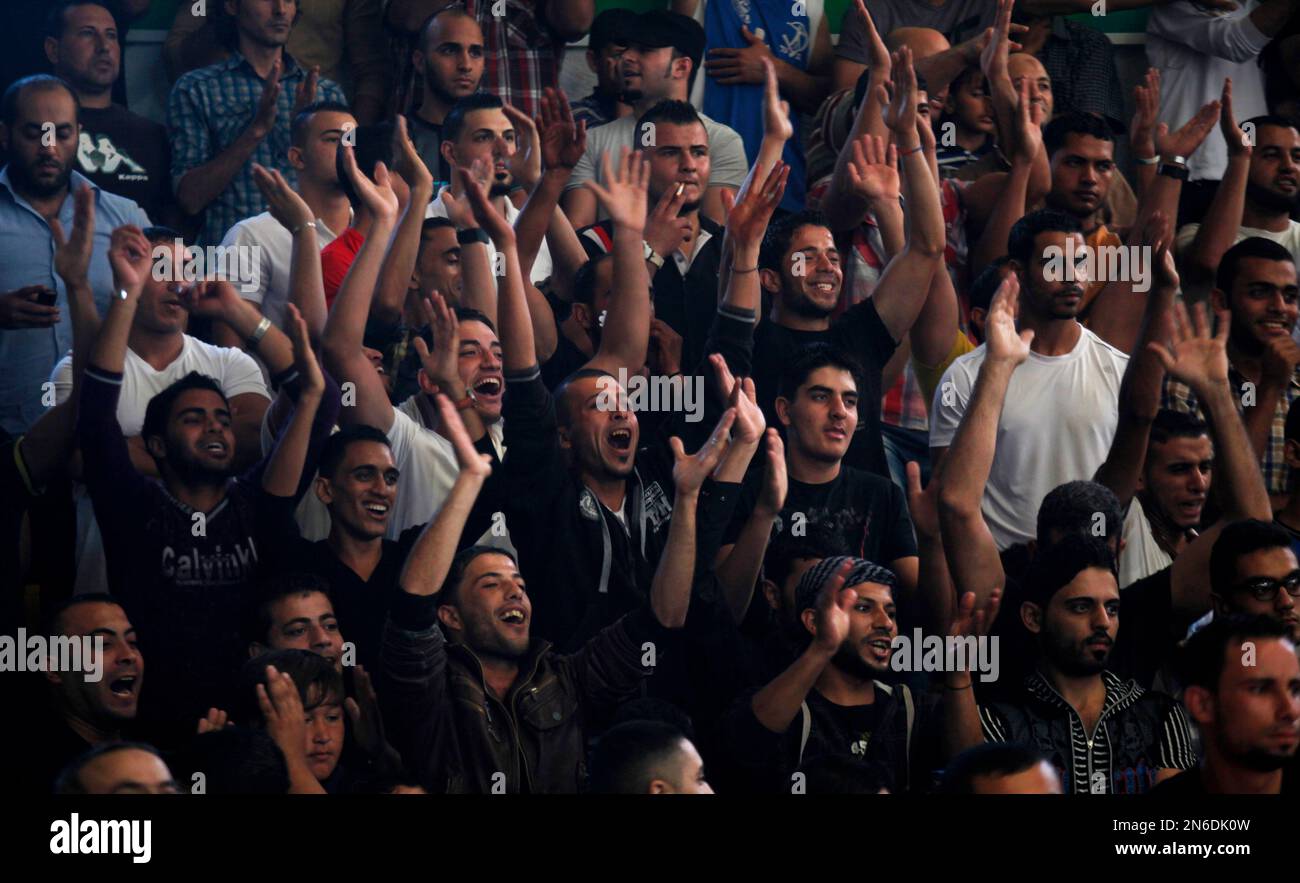 Palestinians cheer on a bodybuilding contest in Gaza City, Saturday ...