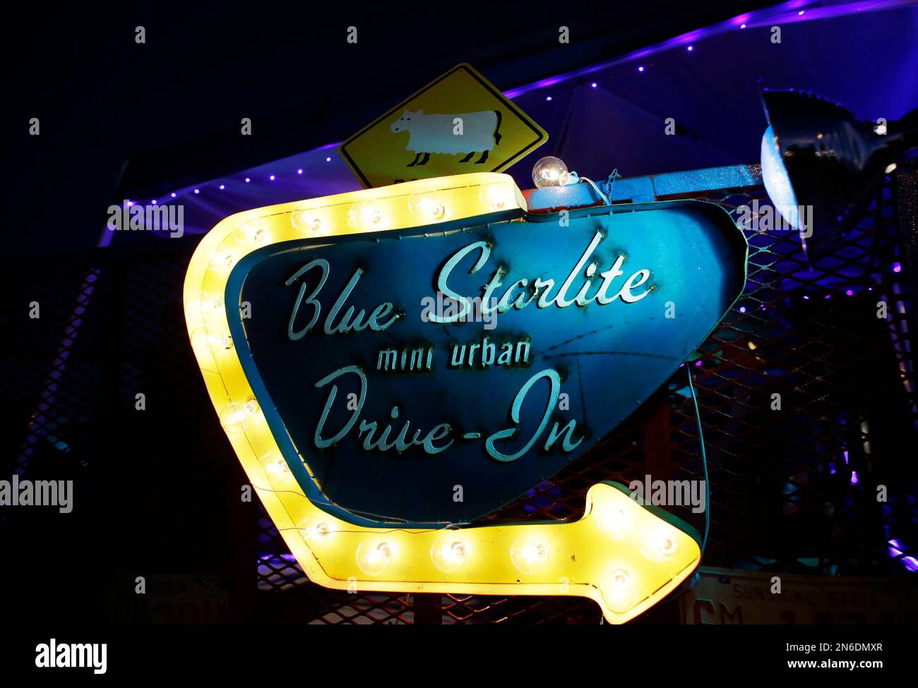 A neon sign glows on the opening night of the Blue Starlite Mini Urban ...