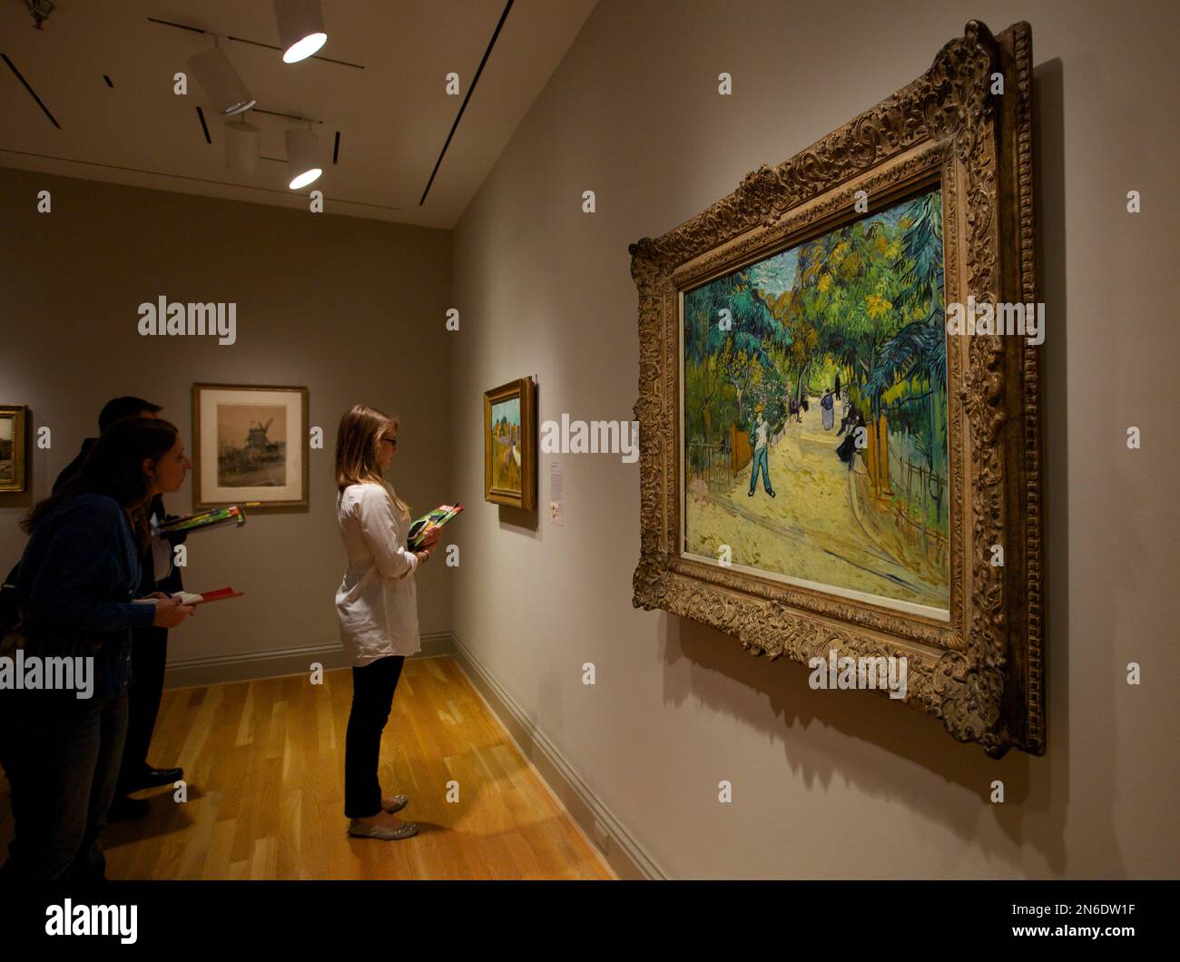 Members of the media look at pieces by Vincent van Gogh, including the ...