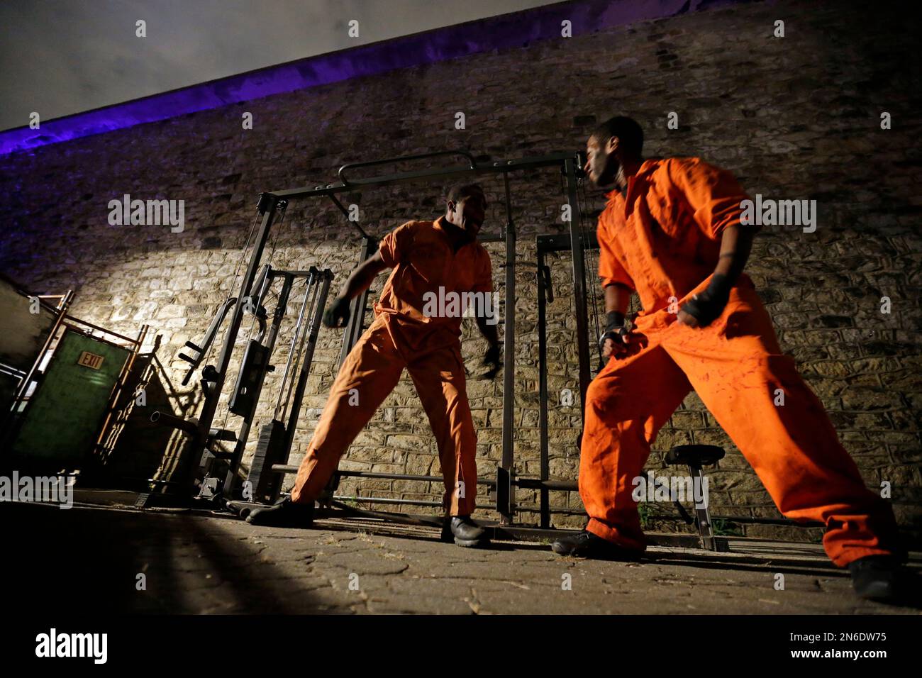 In this Friday, Sept. 27, 2013 photo, actors portraying a zombie ...
