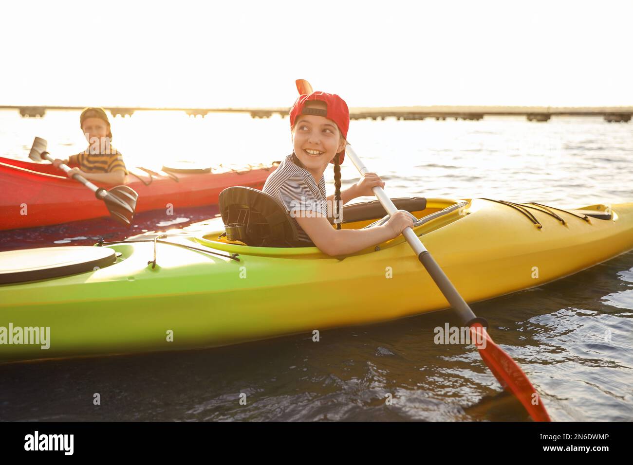 Little children kayaking on river. Summer camp activity Stock Photo - Alamy