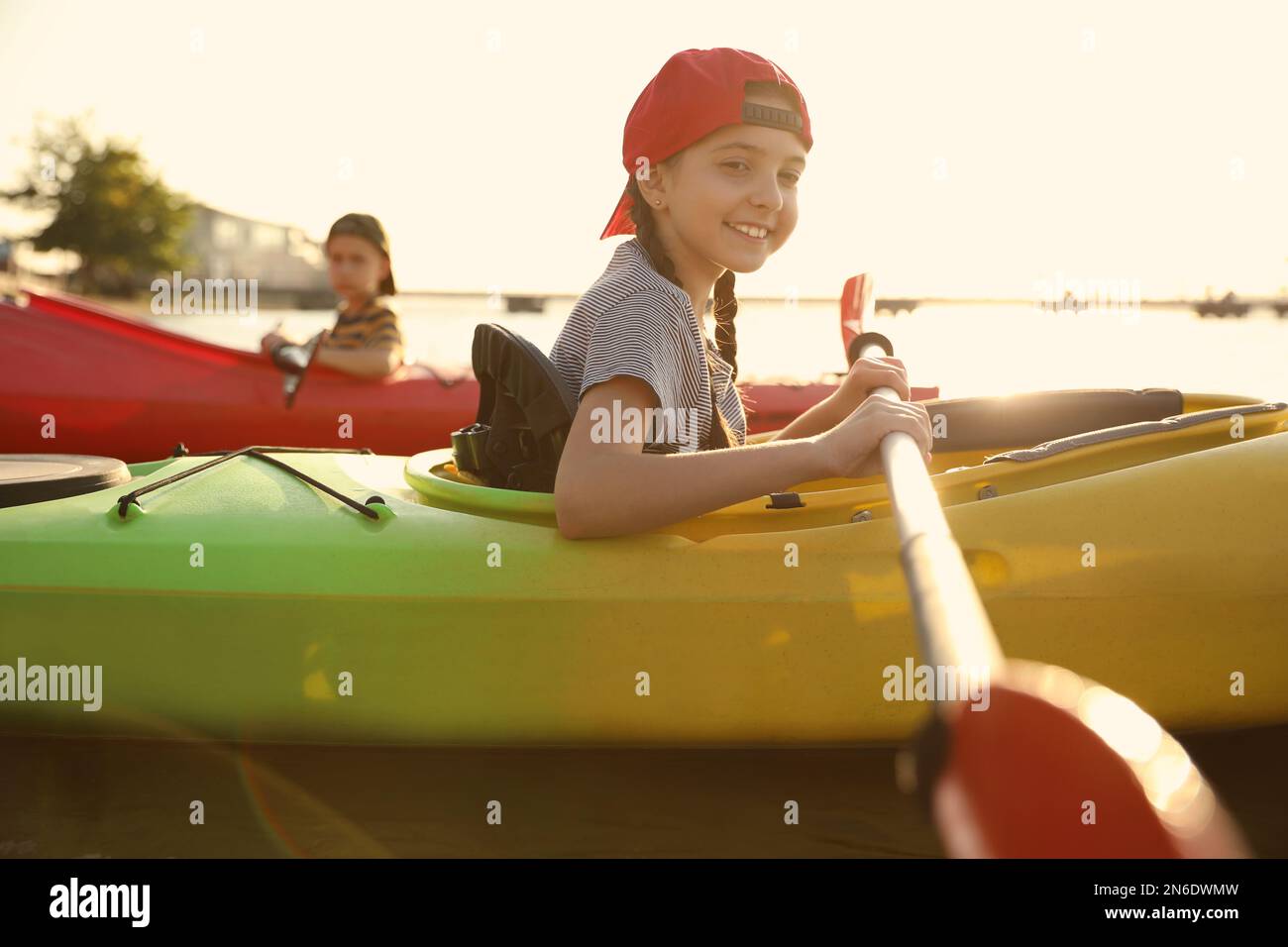 Little children kayaking on river. Summer camp activity Stock Photo - Alamy