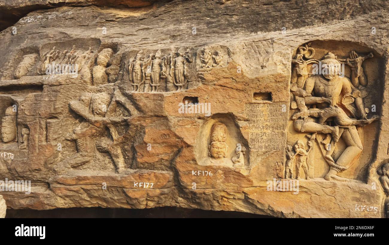 Carvings of Hindu God and Goddess and Ancient script written on rock ...