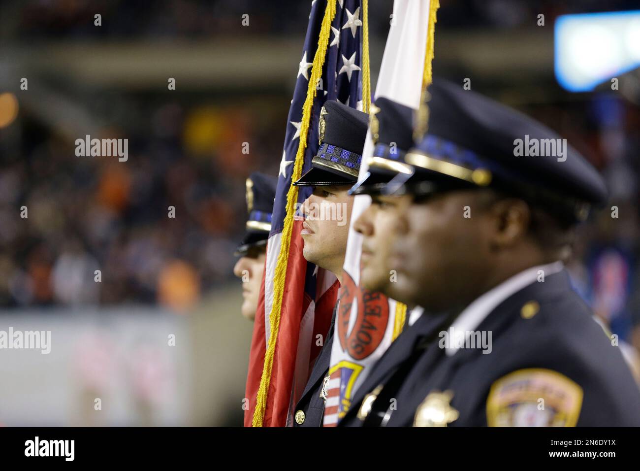 Color guard lines up during the national anthem before an NFL football ...